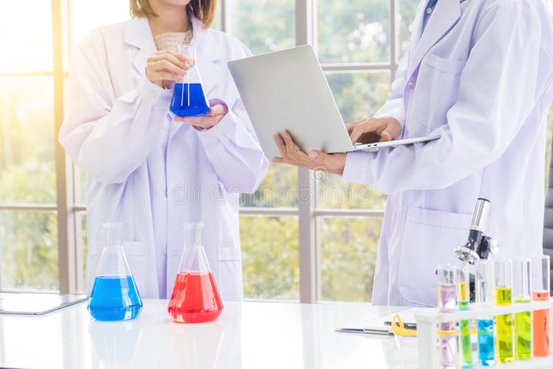 Two Scientists are Researching Research Using Notebooks or Laptop for ...