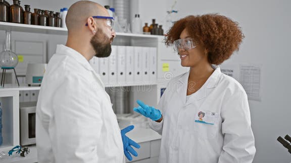 Two Scientists Standing Together Speaking at Laboratory Stock Photo ...