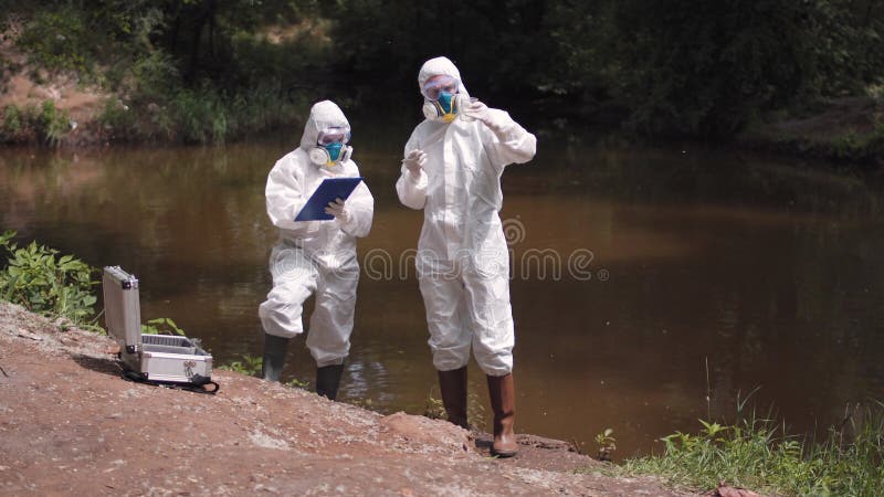 Two Scientists Taking Water Samples from a River Stock Image - Image of ...