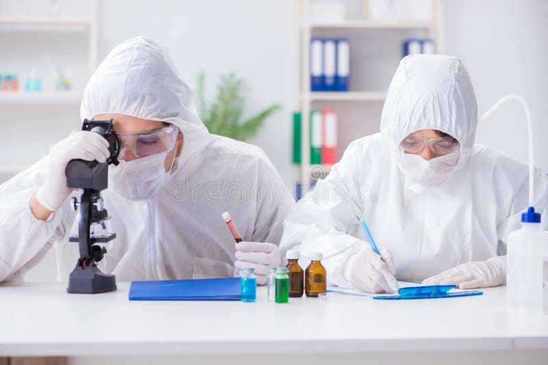 The Two Scientists Working In The Chemical Lab Stock Photo - Image of ... The Two Scientists Working In The Chemical Lab Stock Photo - Image of ...