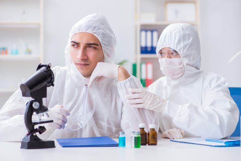 The Two Scientists Working in the Chemical Lab Stock Photo - Image of ...