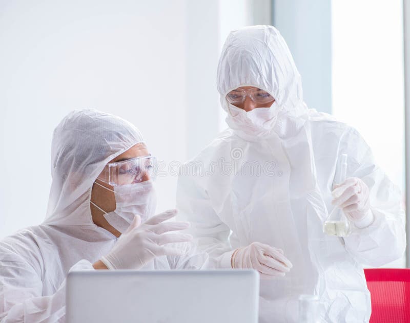 Two Scientists Working in the Chemical Lab Stock Photo - Image of ...