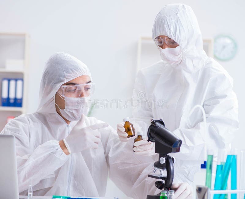 Two Scientists Working in the Chemical Lab Stock Image - Image of ...