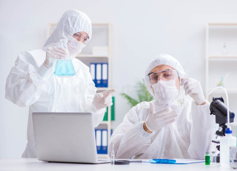Two Scientists Working in the Chemical Lab Stock Image - Image of ...
