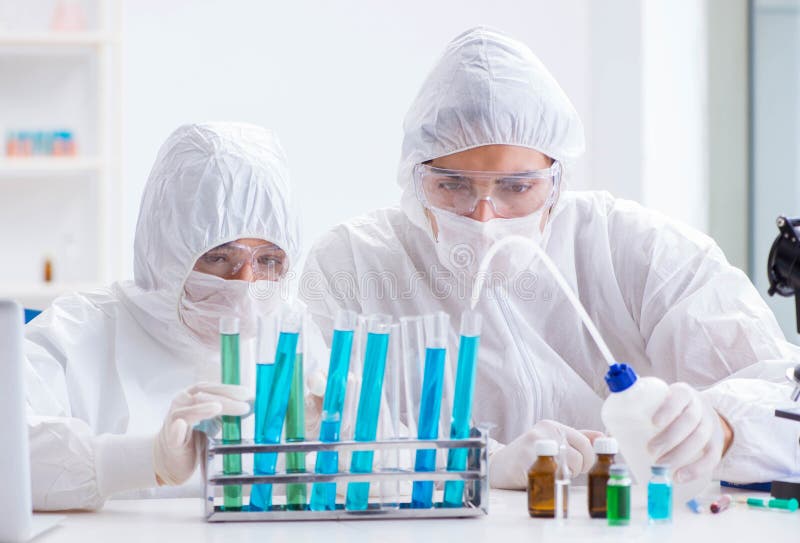 Two Scientists Working in the Chemical Lab Stock Image - Image of ...