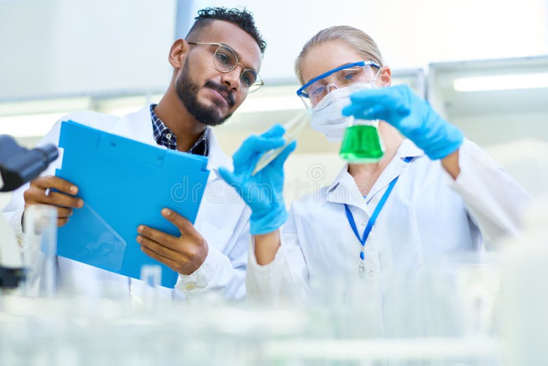 Two Scientists Working in Chemical Laboratory Stock Image - Image of ... Two Scientists Working in Chemical Laboratory Stock Image - Image of ...