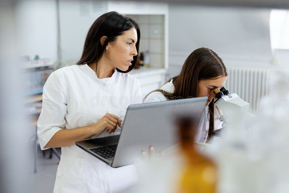 Two Scientists Working in a Laboratory with Computers Stock Photo ...