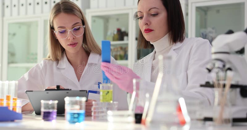 Two Scientists Working in a Laboratory and Testing Petroleum Products ...