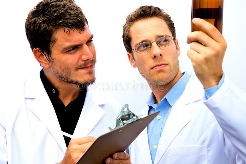 Two Scientists Working Together Stock Image - Image of look, people ...