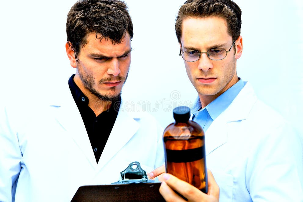 Two Scientists Working Together Stock Image - Image of examine ...