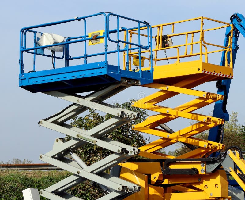 Aerial Working Platforms of Cherry Picker Against Blue Sky with Clouds ...