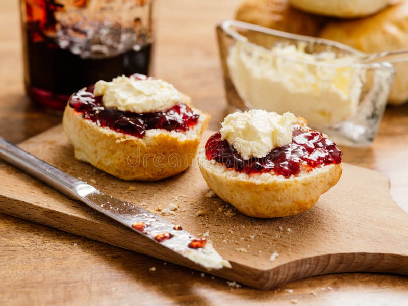 Two Scones with Clotted Cream and Jam Stock Image - Image of scones ...