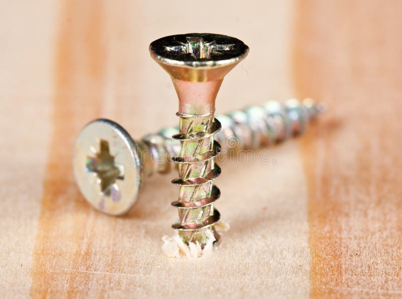 Two Screws on a Wooden Surface Stock Photo - Image of bolt, detail ...