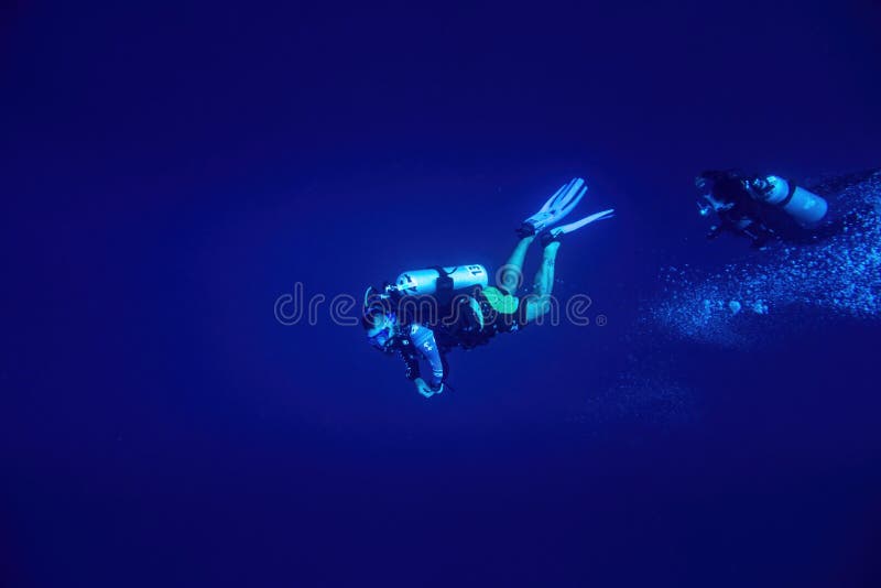Divers in the deep blue stock image. Image of diver, scuba - 407883