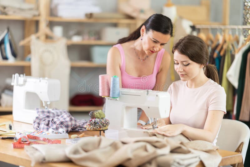 Two Seamstresses Working on Sewing Machines in Sewing Workshop Stock ...
