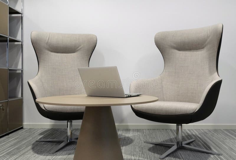 Two Seats and Table with a Laptop in a Meeting Room Stock Photo - Image ...