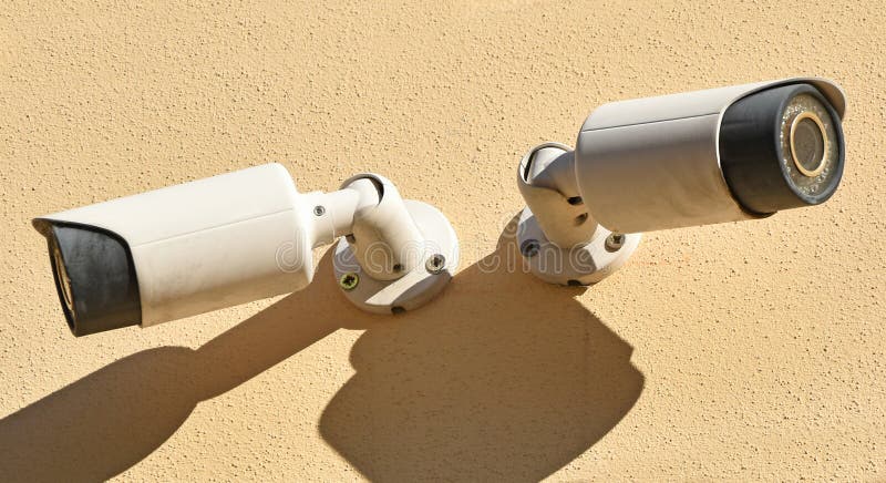 Two Security Cameras on the Wall of a Building Stock Photo - Image of ...