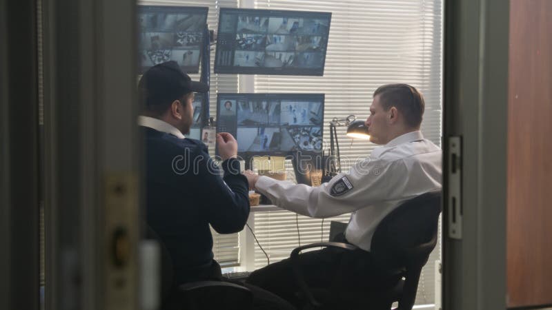 Security Guards Watching the Surveillance Cameras Stock Photo - Image ...