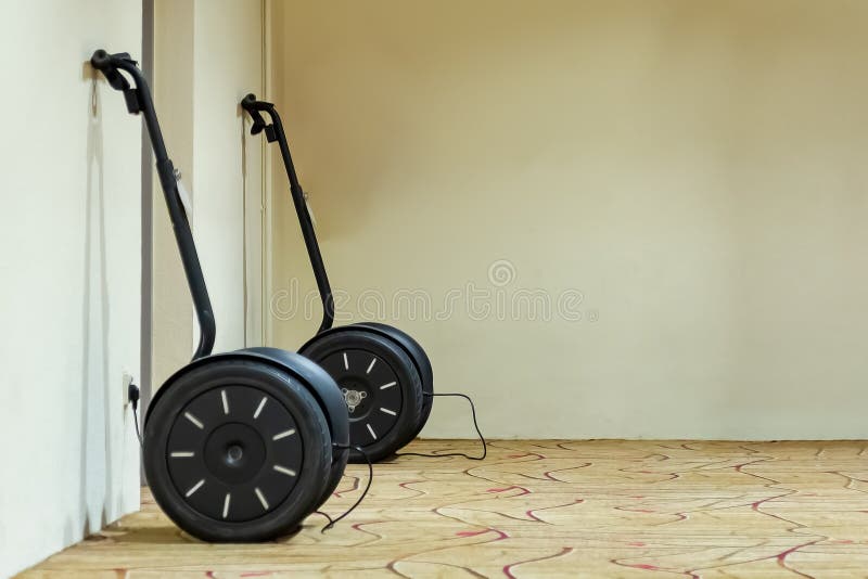 Two Segway on Charge. Stand Against the Wall Stock Photo - Image of ...