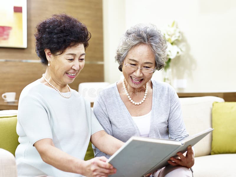 Two Senior Asian Women Reading a Book Together Stock Photo - Image of ... Two Senior Asian Women Reading a Book Together Stock Photo - Image of ...