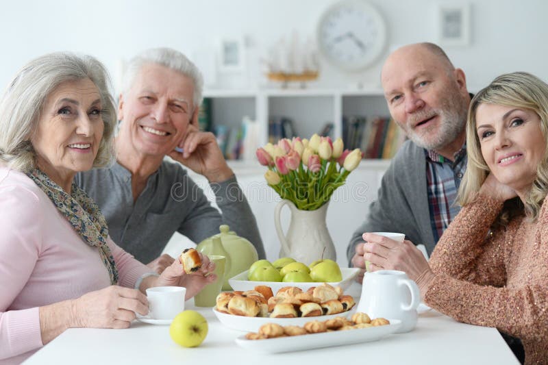 Two Senior Couples Drinking Tea Stock Image - Image of portrait ...