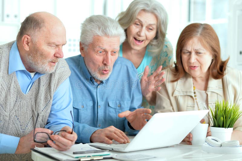 Two Senior Couples Sitting at Table Stock Image - Image of couples ...