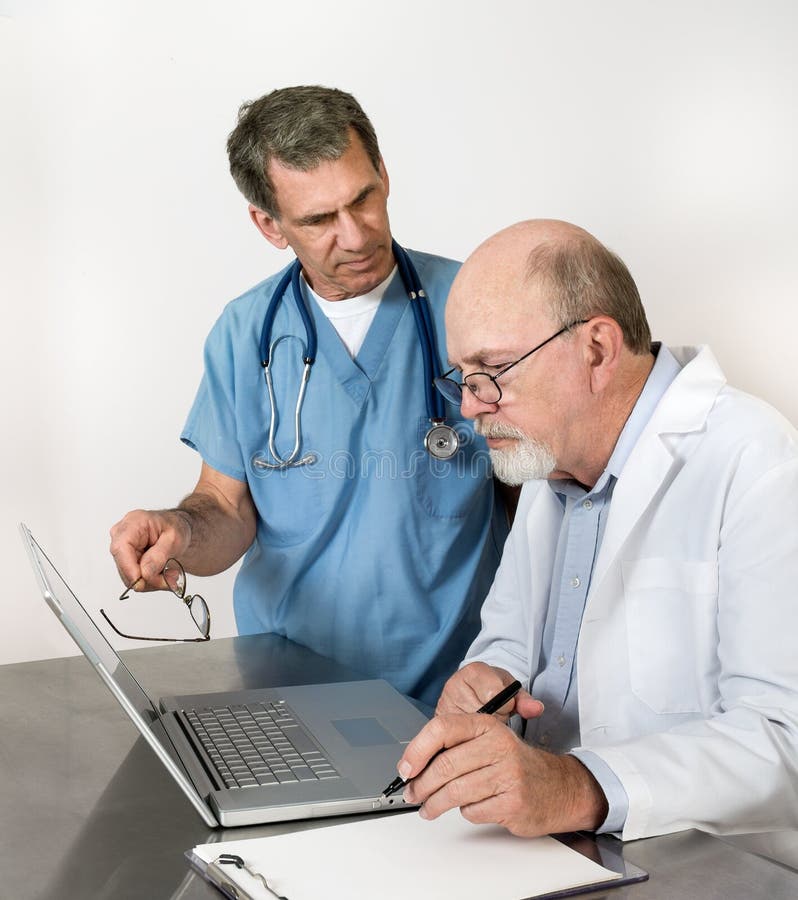 Two Senior Doctors at Laptop Computer Stock Image - Image of insurance ...