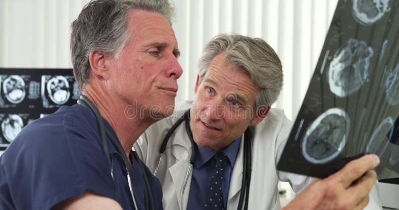 Two Senior Doctors Working in the Office Stock Video - Video of sitting ...