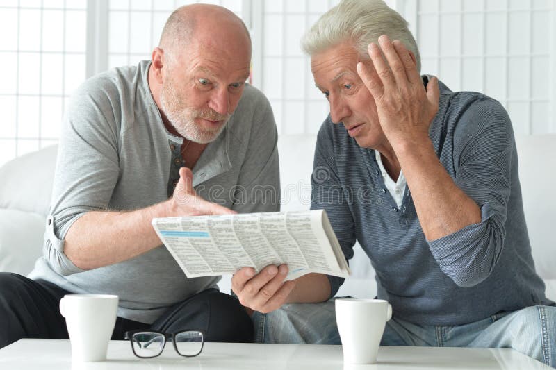 Two Old Men Sitting at Table and Discussing News Stock Photo - Image of ...