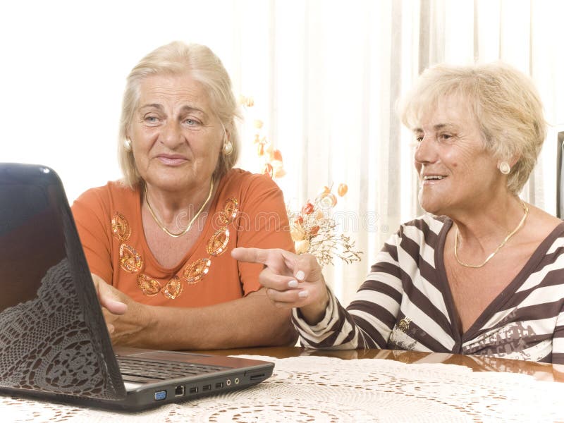Two Senior Women with Laptop Stock Image - Image of happy, grey: 14757169