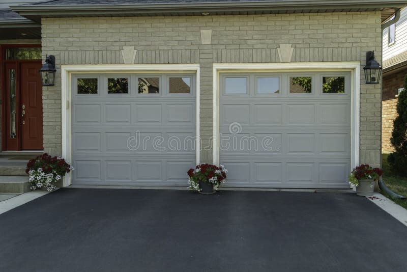 Two Separate Garages in One House Stock Photo - Image of landscaping ...