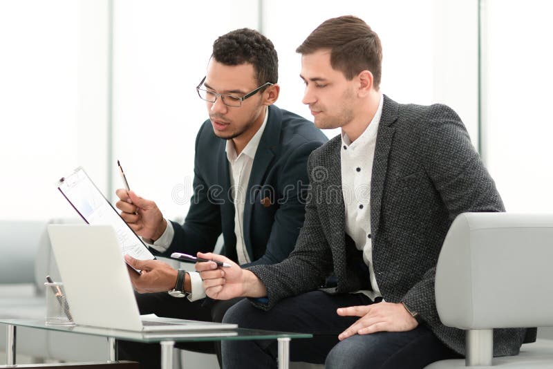 Two Serious Business People Discuss Business Documents. Stock Image ...