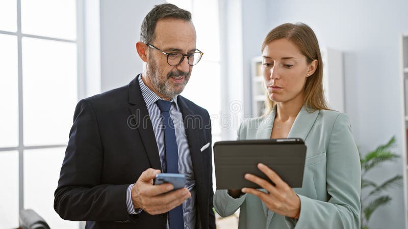 Two Serious Business Workers Together, Standing in an Elegant Office ...