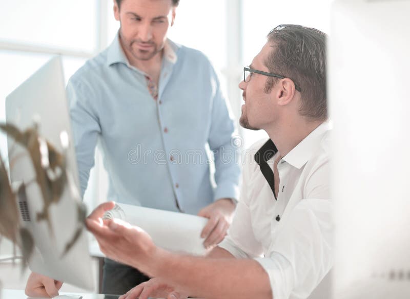 Two Serious Businessmen Talking and Working in the Office Stock Photo ...
