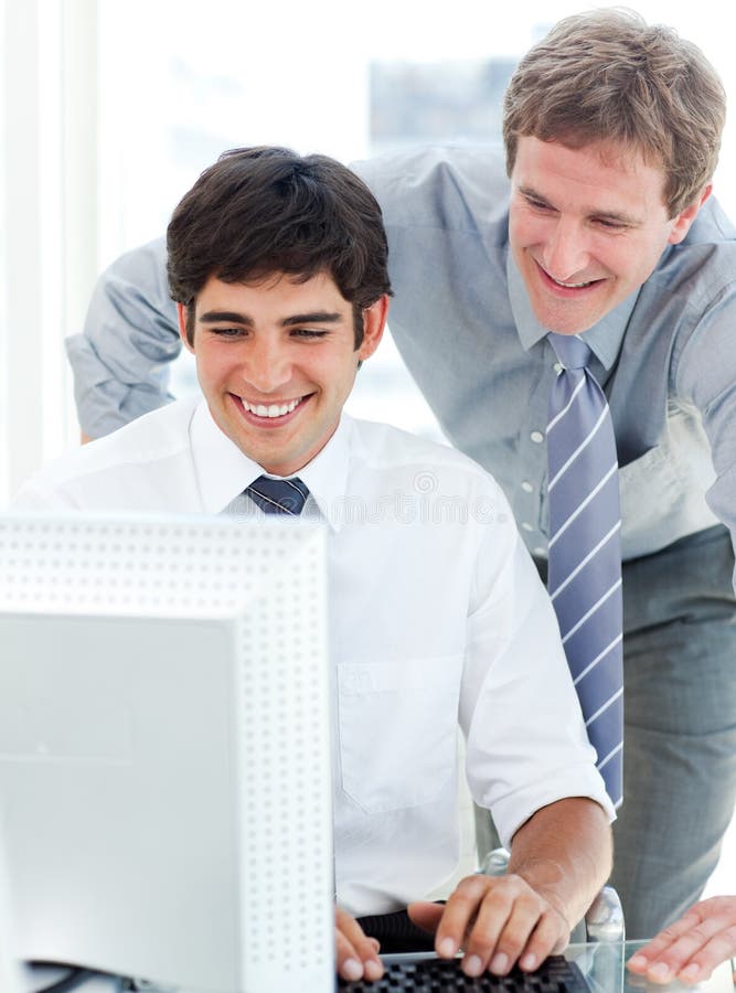 Two Serious Businessmen Working at a Computer Stock Photo - Image of ...