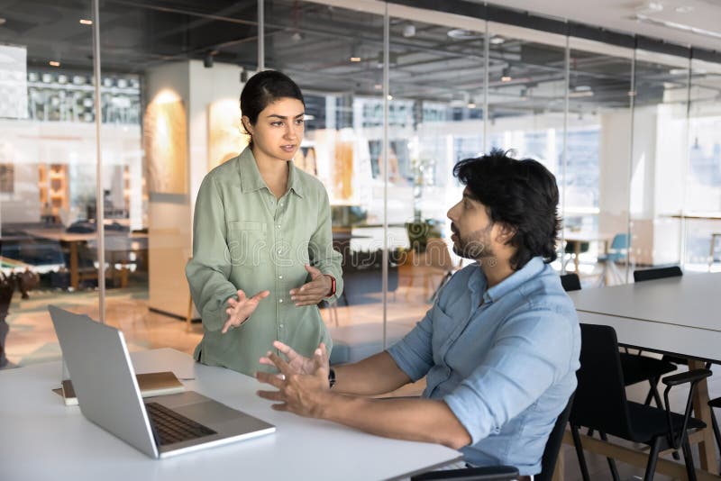 Two Serious Busy Young Indian Professionals Talking at Workplace Stock ...