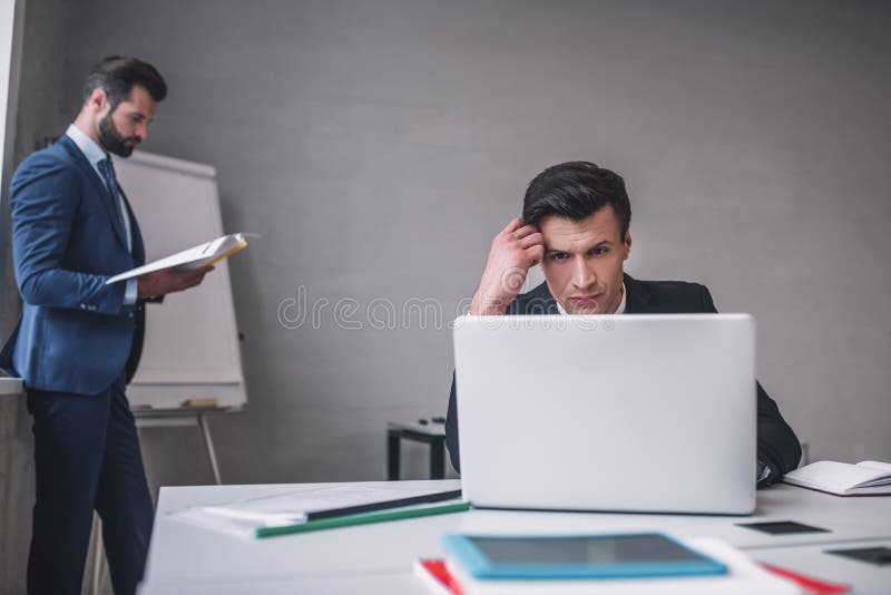 Two Serious Men in Suits Working in Office Stock Photo - Image of ...
