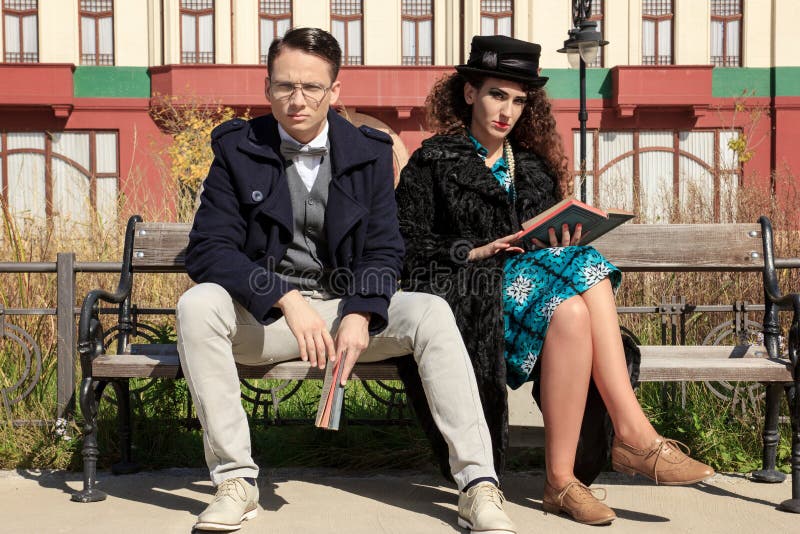 Two Serious People Sitting on Bench Reading Book Stock Photo - Image of ...