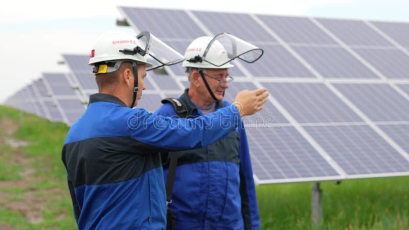 Two Service Engineers or Electrician Working on Checking Transformer ...