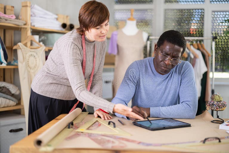 Two Sewing Workshop Workers Draw Patterns on Electronic Tablet Stock ...