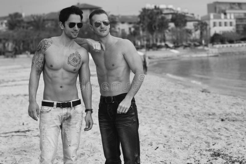 Two Men Posing on the Beach Stock Image - Image of shirtless, outdoor ...