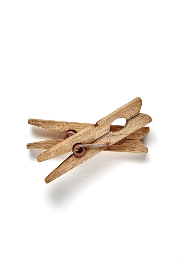 Two Shabby Vintage Wooden Clothespins Isolated on a White Background ... Two Shabby Vintage Wooden Clothespins Isolated on a White Background ...
