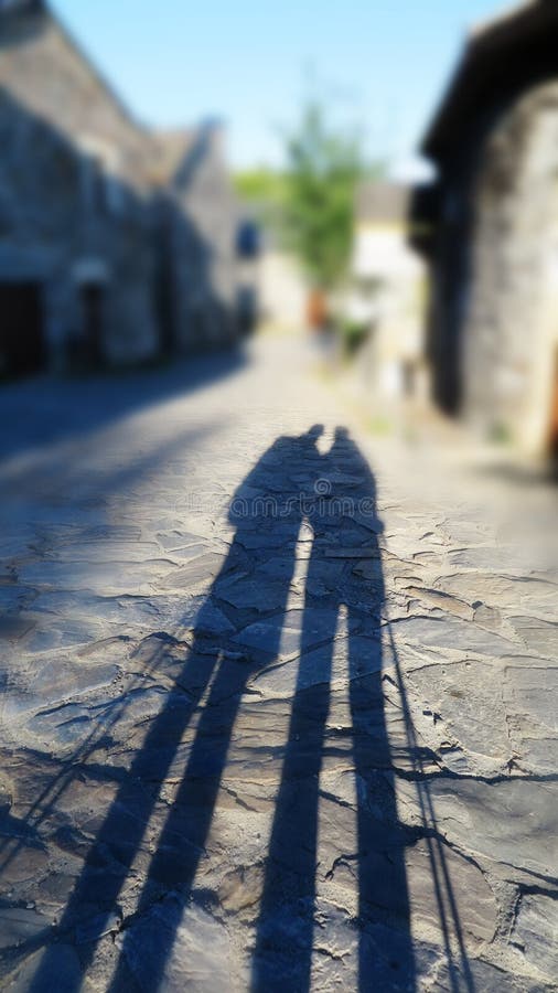 Two Shadows on our path stock photo. Image of penance - 82763788