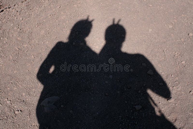 Long shadow of two lovers stock image. Image of engagement - 42653663