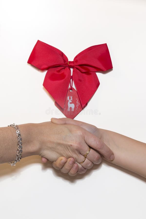 Two Shaking Hands Under a Red Ribbon Stock Photo - Image of handshake ...