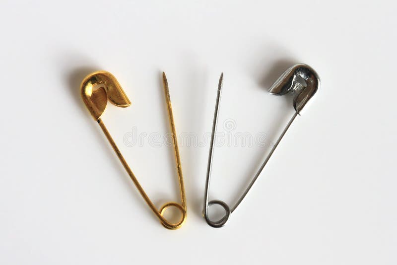 Two Sharp Pins In The Form Of Red Hearts Near And One Blue Stuck Stock ...