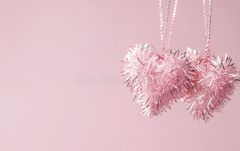 Two Shimmering Pink Tinsels Dangle Gracefully from a Delicate String ...