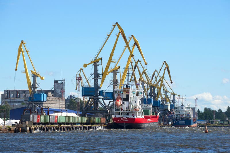 Two Ships on Loading in Cargo Port of the City of Vyborg. Russia ...