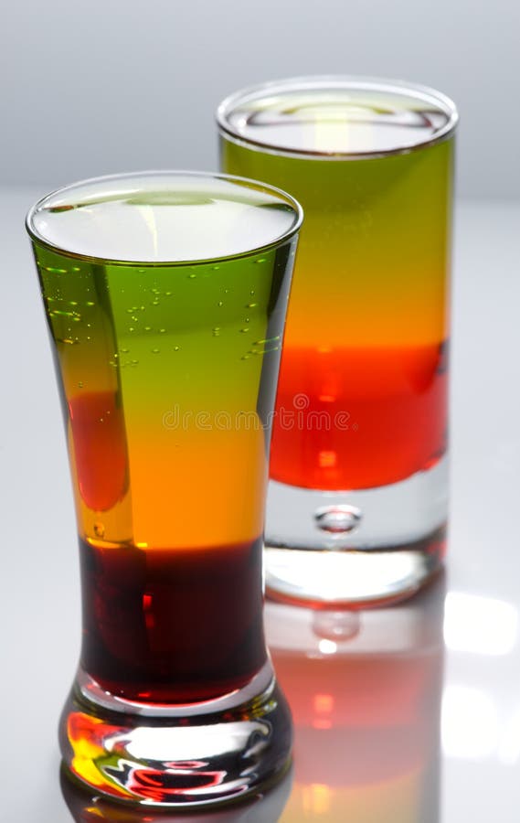 Two Shot Glasses with Colorful Cocktails Stock Photo - Image of risk ...