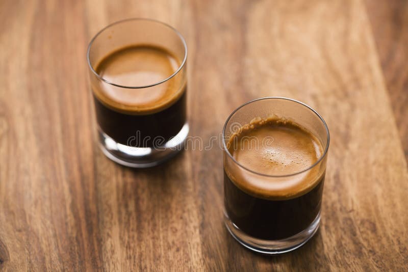 Two Shots of Espresso on Wood Table Stock Image - Image of cappuccino ...